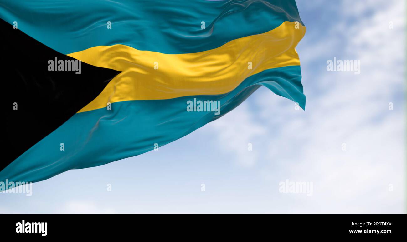 Close-up view of the Bahamas national flag waving in the wind. Black ...