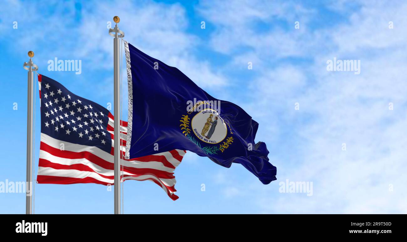 Flags of Kentucky and the United States waving in the wind on a clear ...