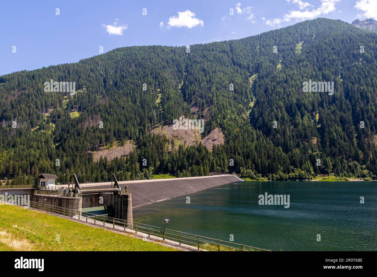 Artificial alpine reservoir lake Zoccolo and mountain range at Ultental ...