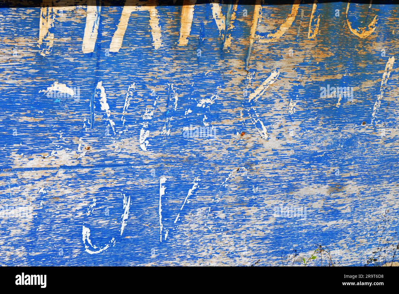Hand written advertising painted on side of blue hut, Hair braiding and ...