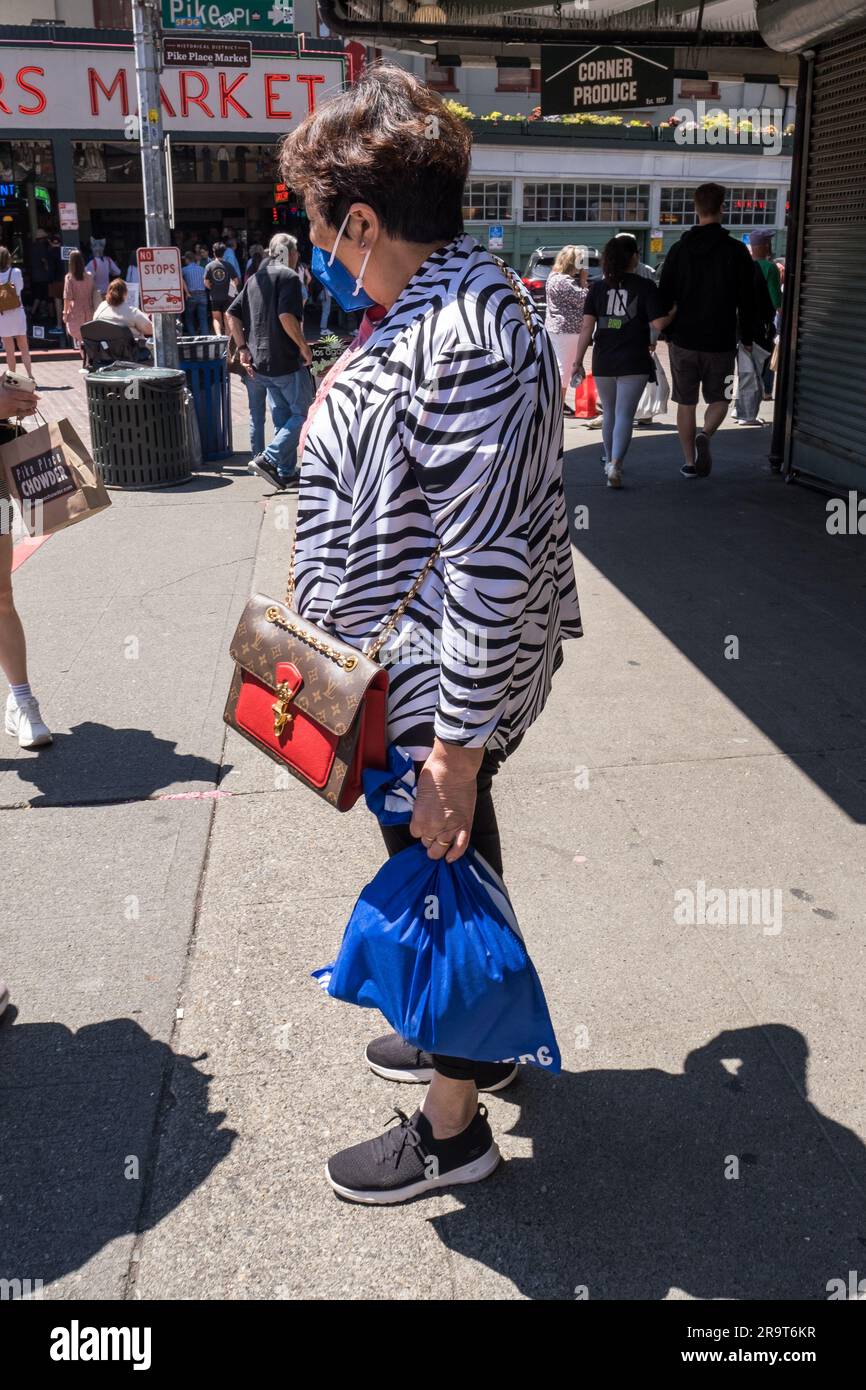 Seattle, USA. 12 Jun, 2023. A person with a Louie bag visiting Pike ...
