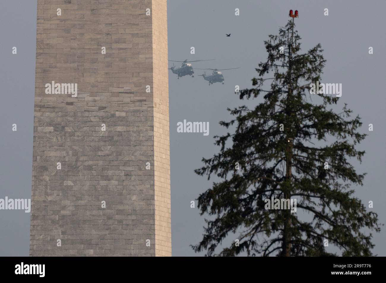 The Marine One Helicopter, carrying President Joe Biden, is seen past ...