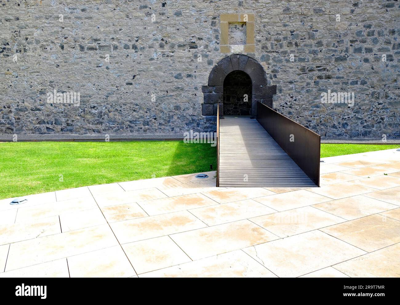 Entrance to a castle museum, ancient stone wall, Middle Ages ...