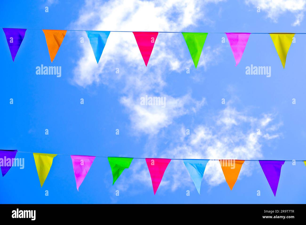 Strings of vibrant color flags / pennants Stock Photo - Alamy