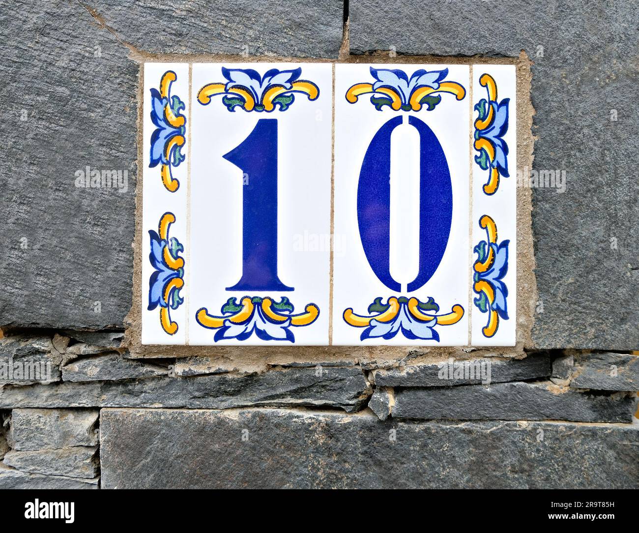 Number ten / 10, tiles on a wall, home number Stock Photo - Alamy