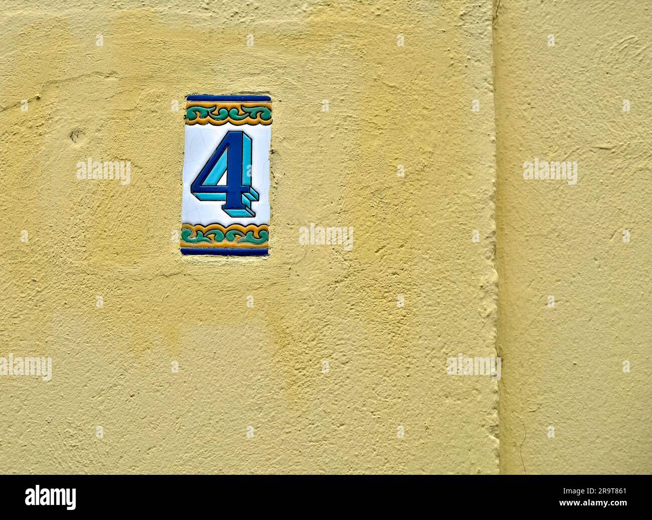 4, number four, blue number on a yellow surface Stock Photo - Alamy