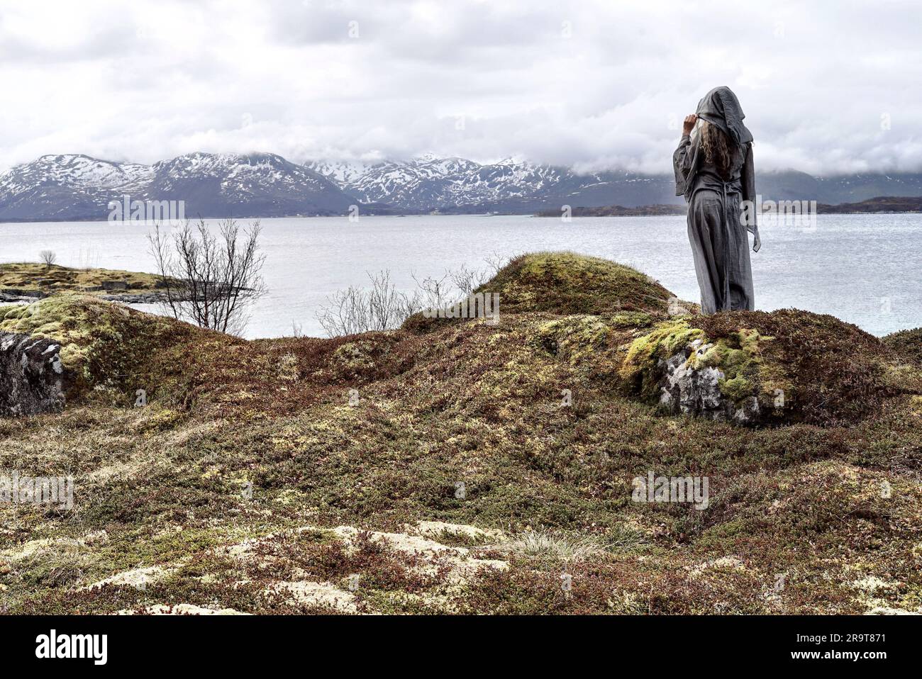 Norse pagan woman making an offering to the sea Stock Photo - Alamy