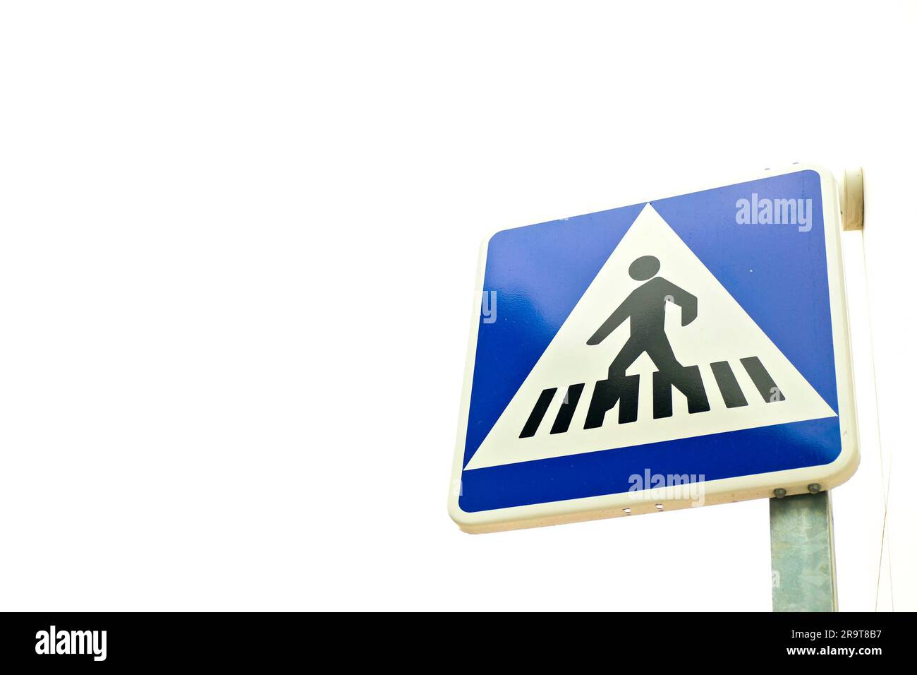 A pedestrian crossing the street, zebra croosing road sign on white ...
