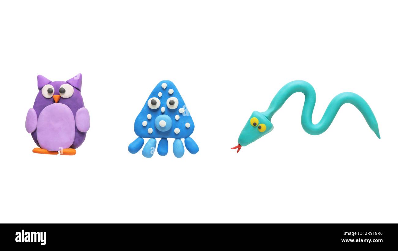 Colorful plasticine, owl, snake and octopus on white background, top ...