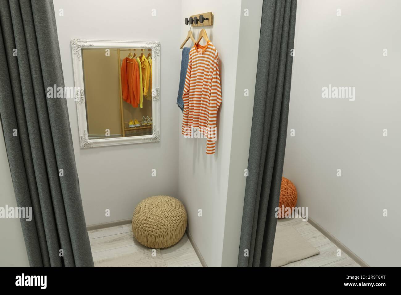 Dressing room with mirror in fashion store. Stylish design Stock Photo ...