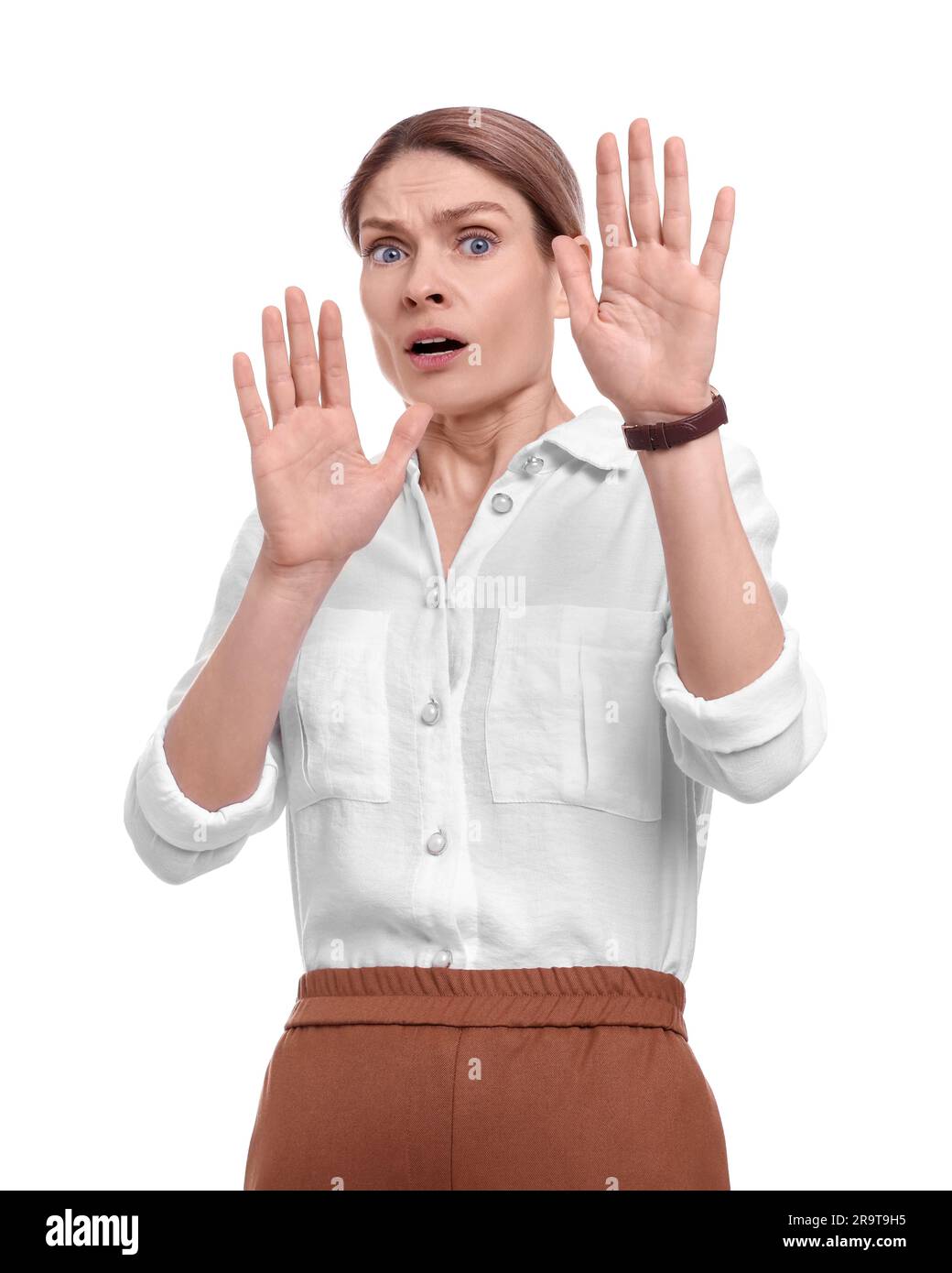 Beautiful emotional businesswoman avoiding something on white ...