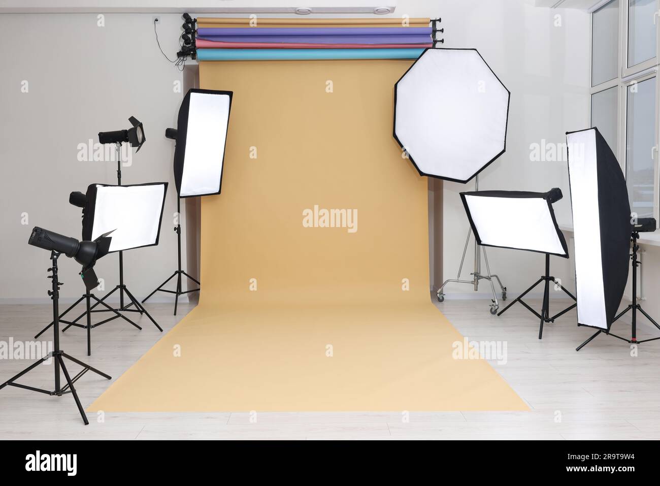 Interior of modern photo studio with professional lighting equipment ...