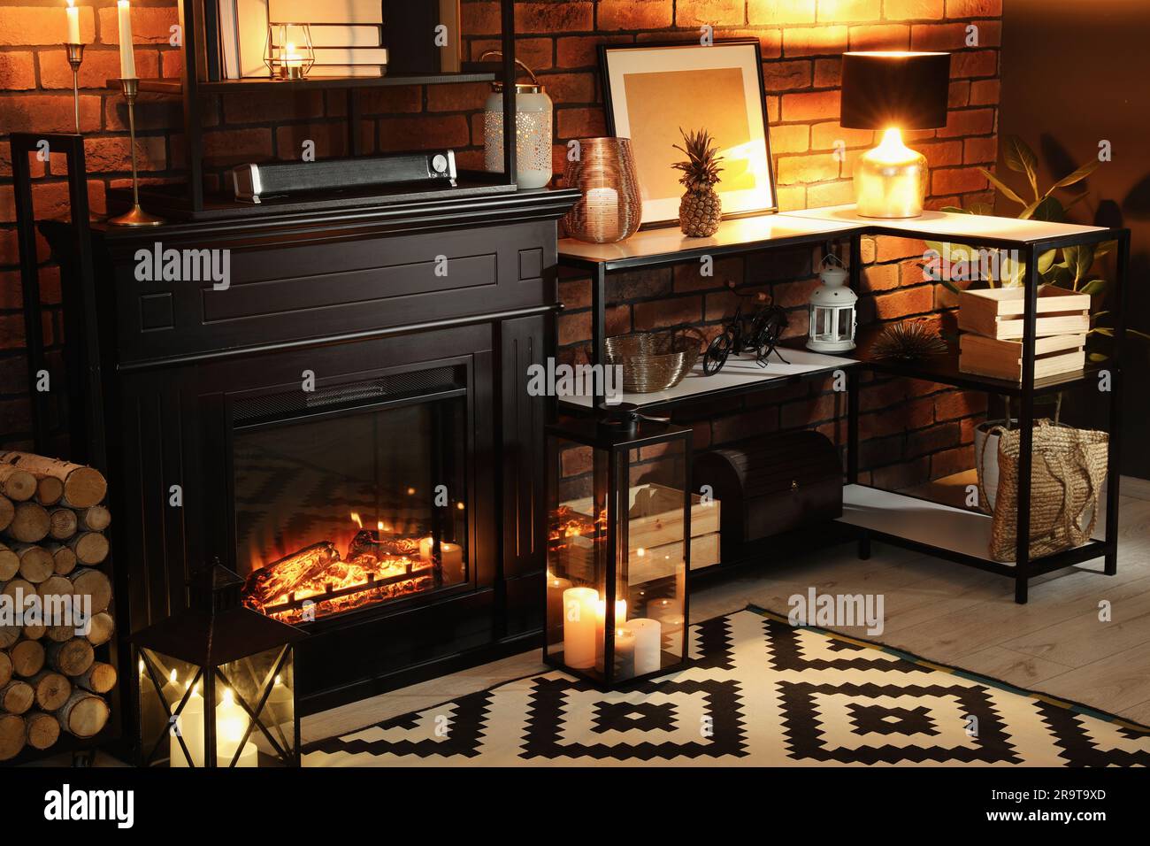Beautiful fireplace and different decor in living room at night ...