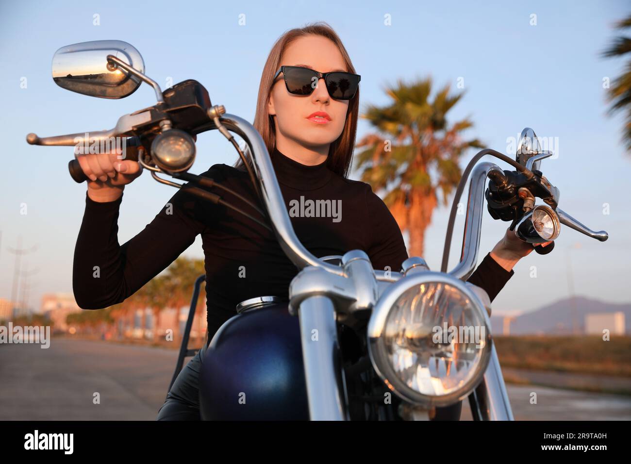 Beautiful young woman riding motorcycle hi-res stock photography and ...