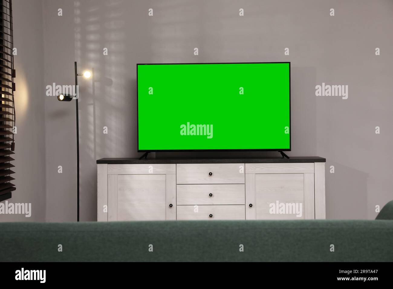 Chroma key compositing. TV with mockup green screen in room. Mockup for ...