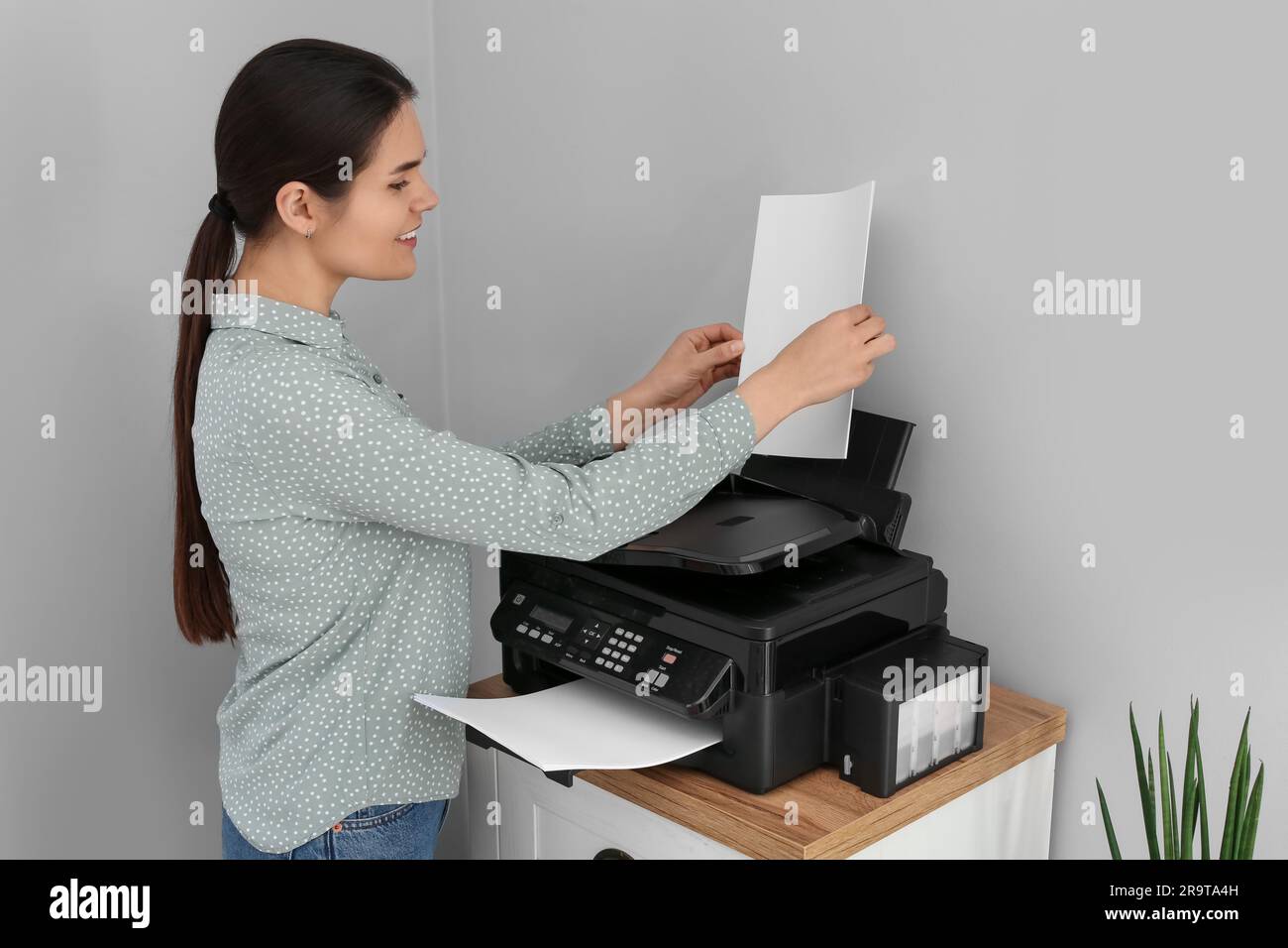 Person using printer at home hi-res stock photography and images - Alamy