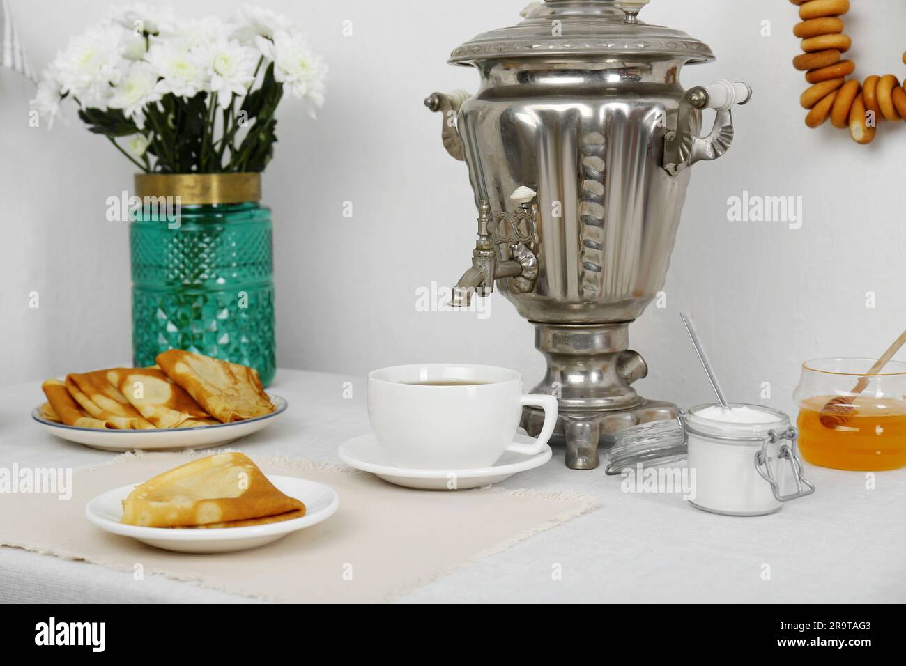Vintage Samovar Cup Of Hot Drink And Snacks Served On Table