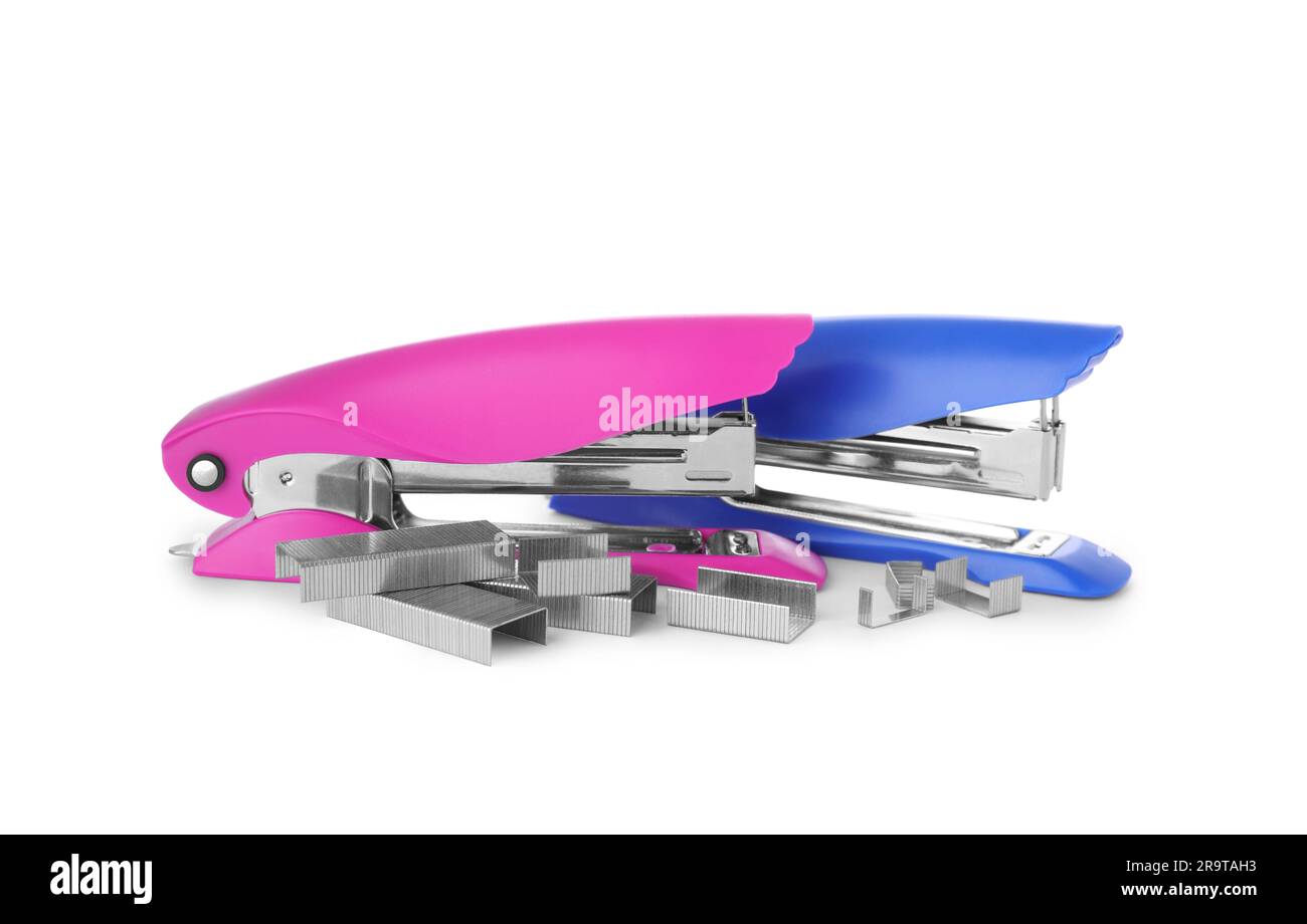 Bright color staplers with staples isolated on white Stock Photo - Alamy