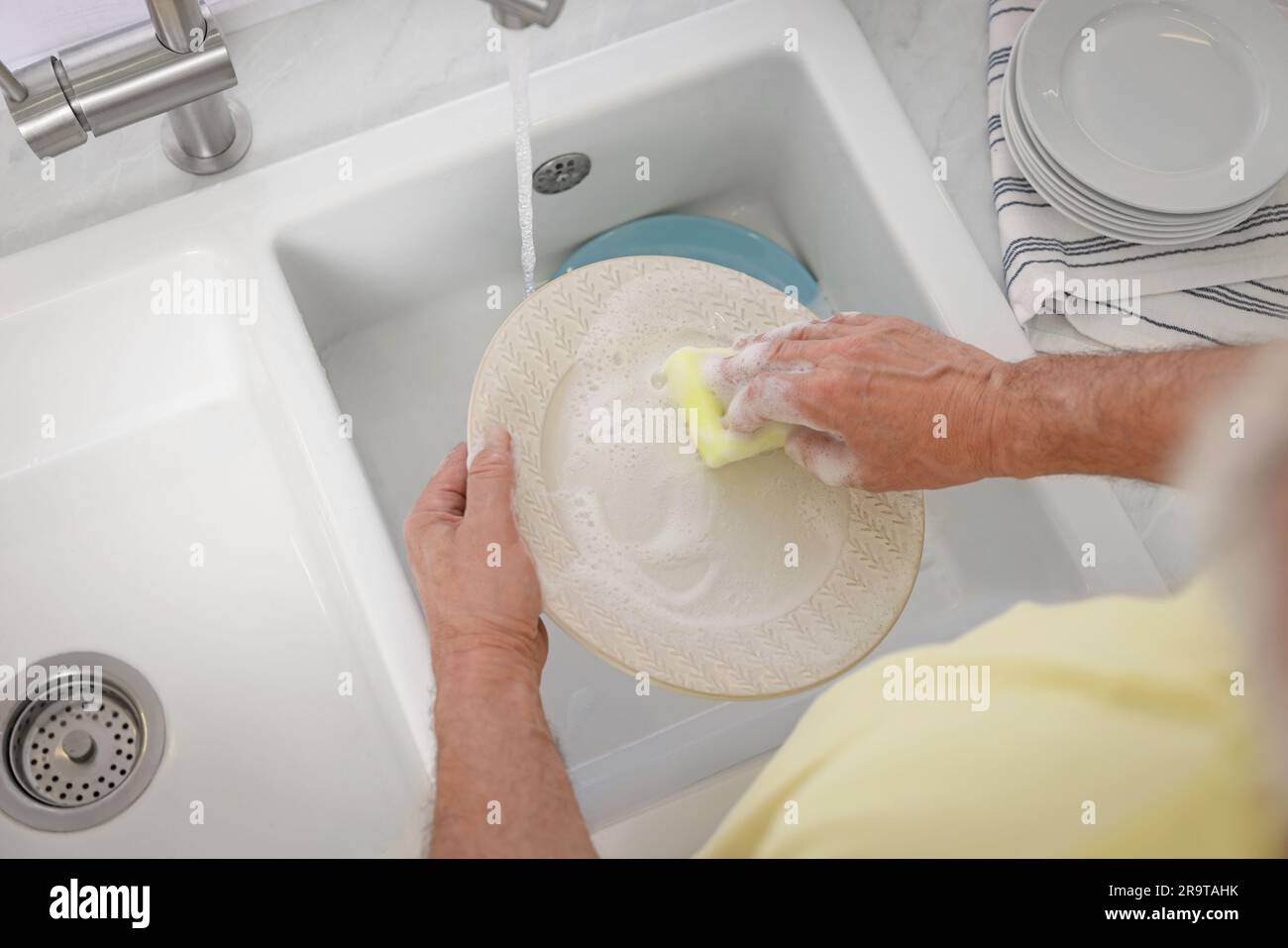 Senior male washing hands hi-res stock photography and images - Alamy