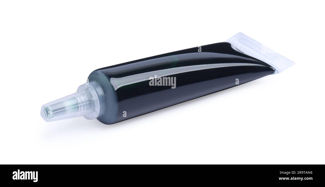 Tube with green food coloring on white background Stock Photo - Alamy