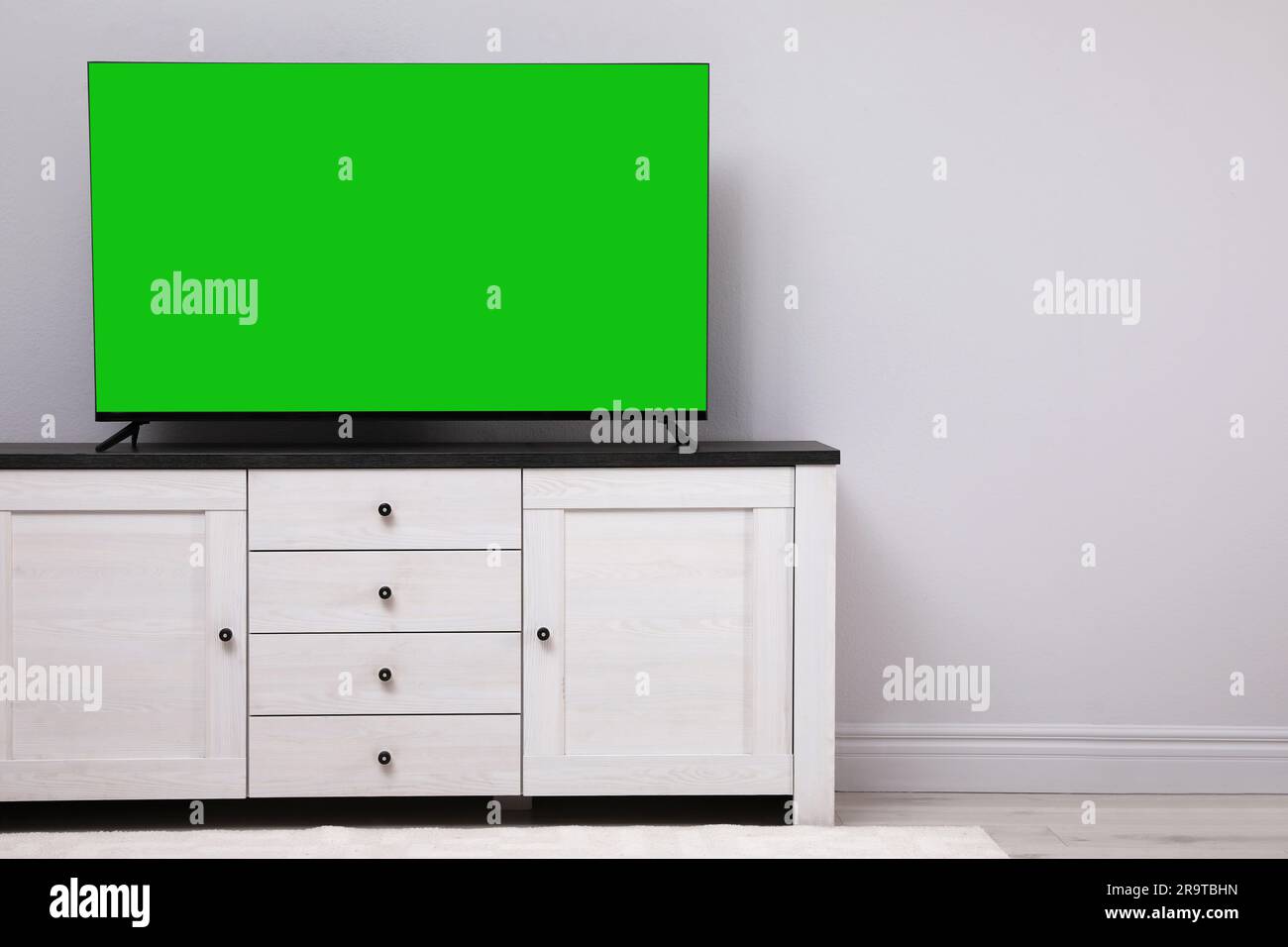 Chroma key compositing. TV with mockup green screen in room. Mockup for ...