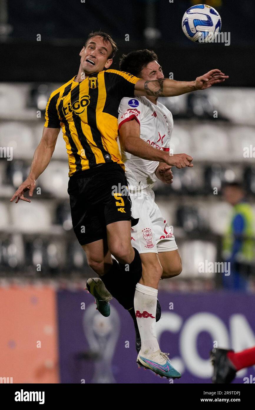 Gaston Gil of Paraguay's Guarani, left, and Matias Coccaro of Argentina ...