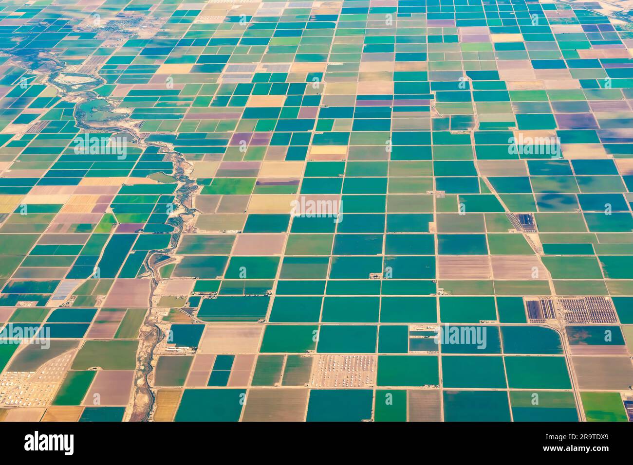 Aerial view of farmland in the American southwest, with green squares ...