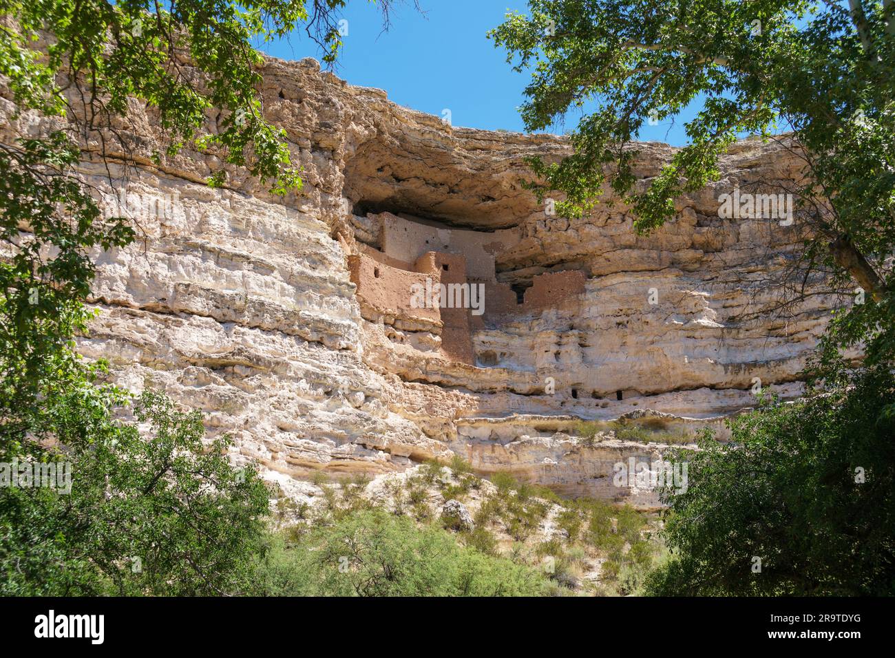 Montezuma's castle cliff dwelling in Camp Verde, viewed through green ...
