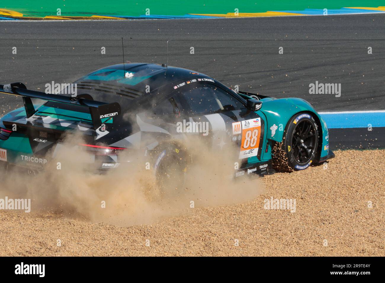 Porsche 911, car number 88 at le mans race stuck in gravel near dunlop ...