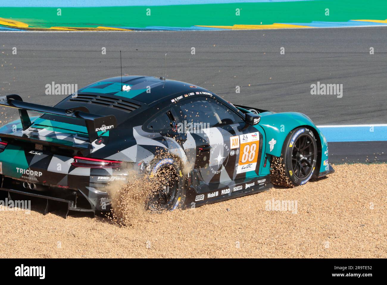 Porsche 911, car number 88 at le mans race stuck in gravel near dunlop ...