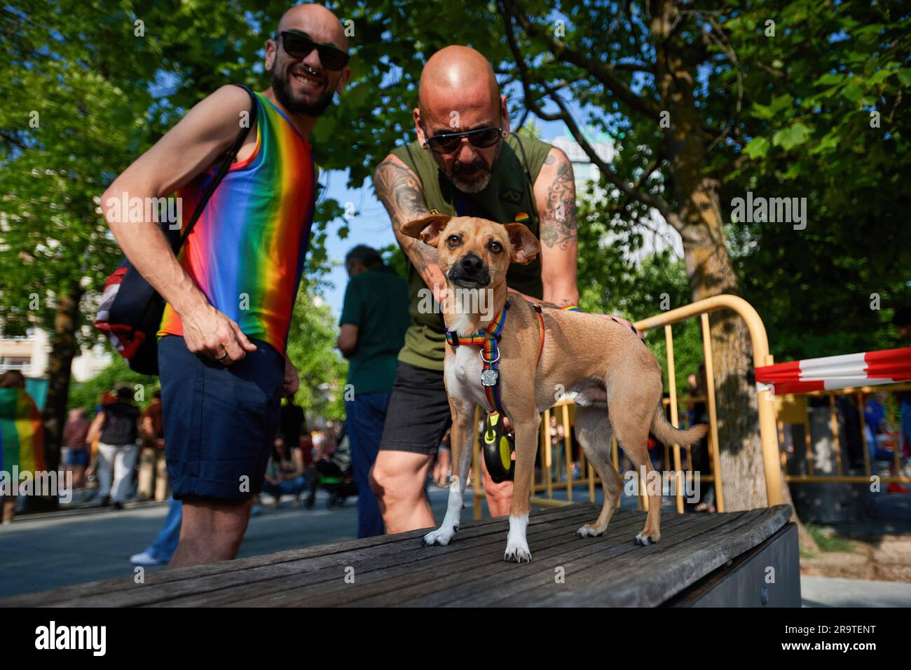 Pamplona, Spain. 28th June, 2023. Two protesters with their dog take ...
