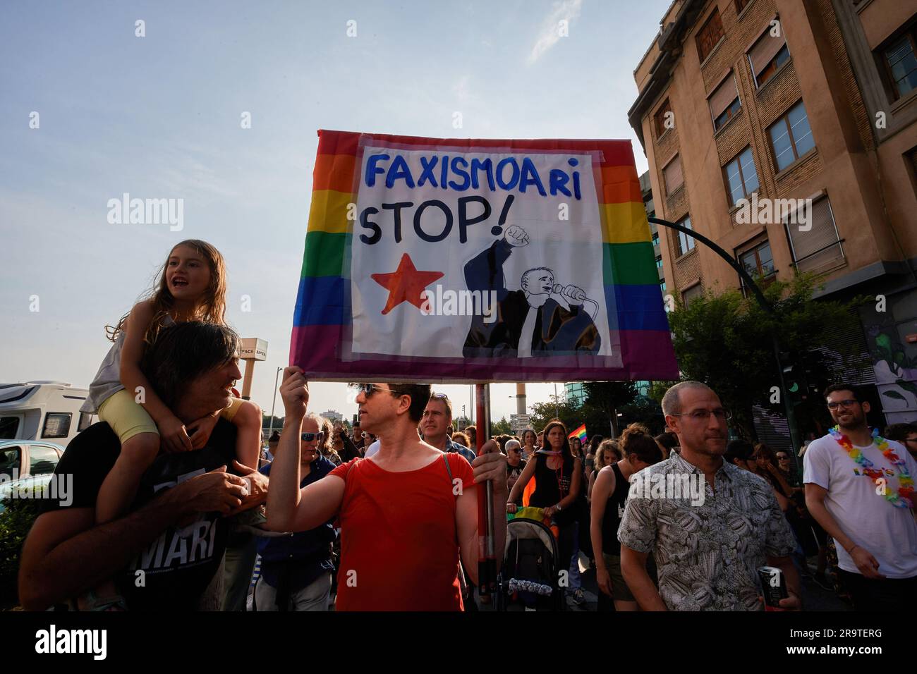Pamplona, Spain. 28th June, 2023. A protester holds a placard that says ...