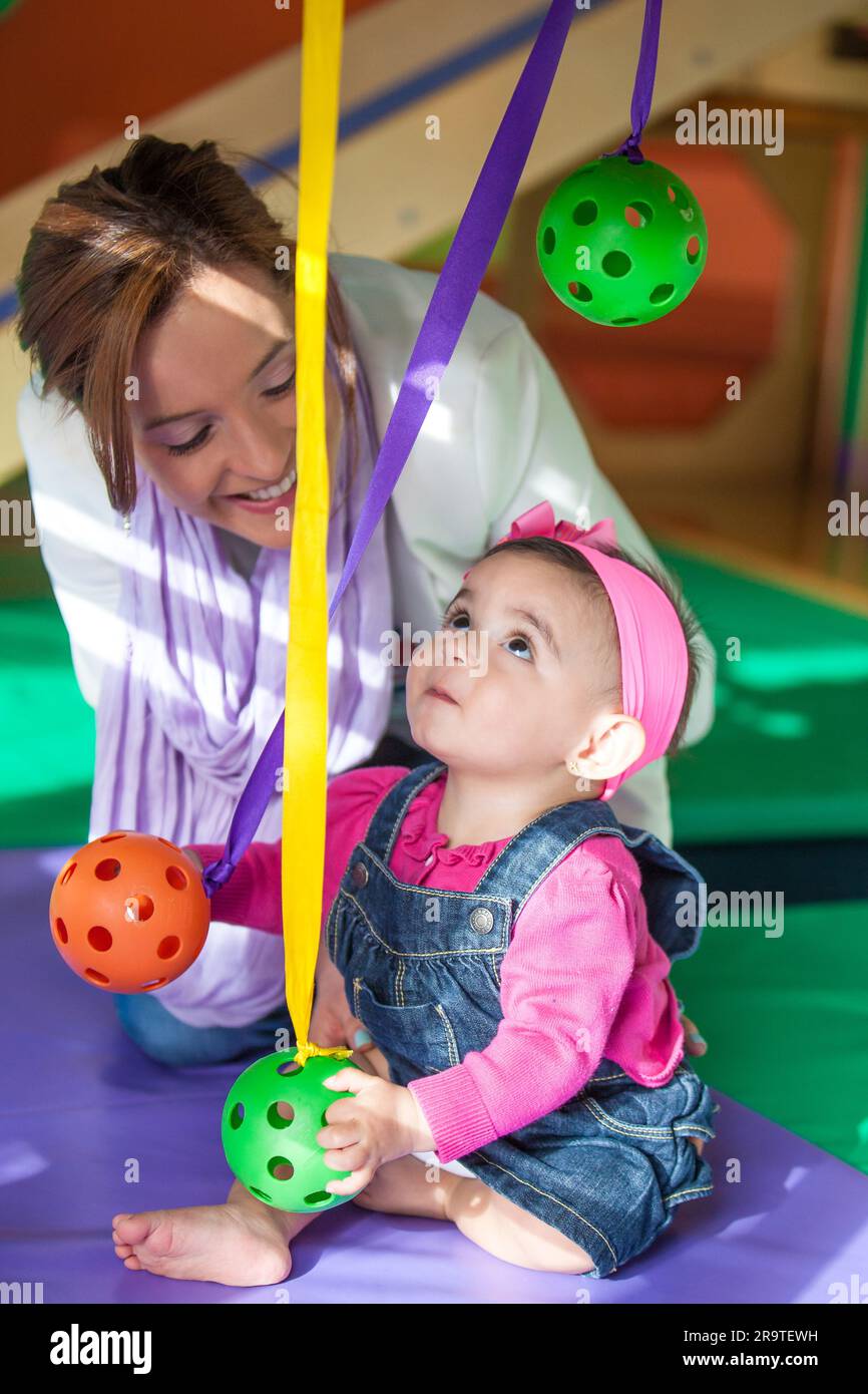 Beautiful ten months baby girl playing with her mom. Early stimulation ...