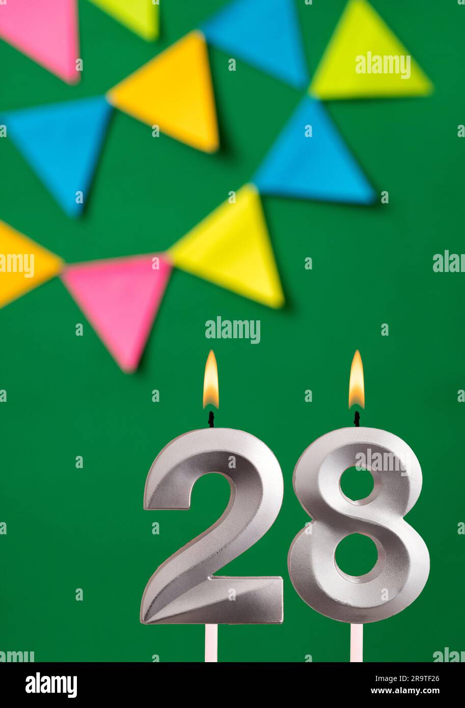 Vertical birthday card with number 28 candle - Green background with ...