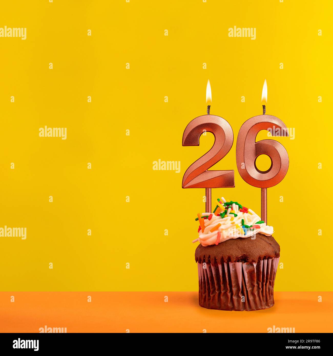 Number 26 birthday candle - Celebration on yellow background Stock ...