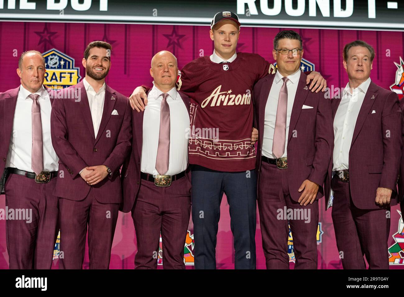 Daniil But poses with Arizona Coyotes officials after being picked by ...