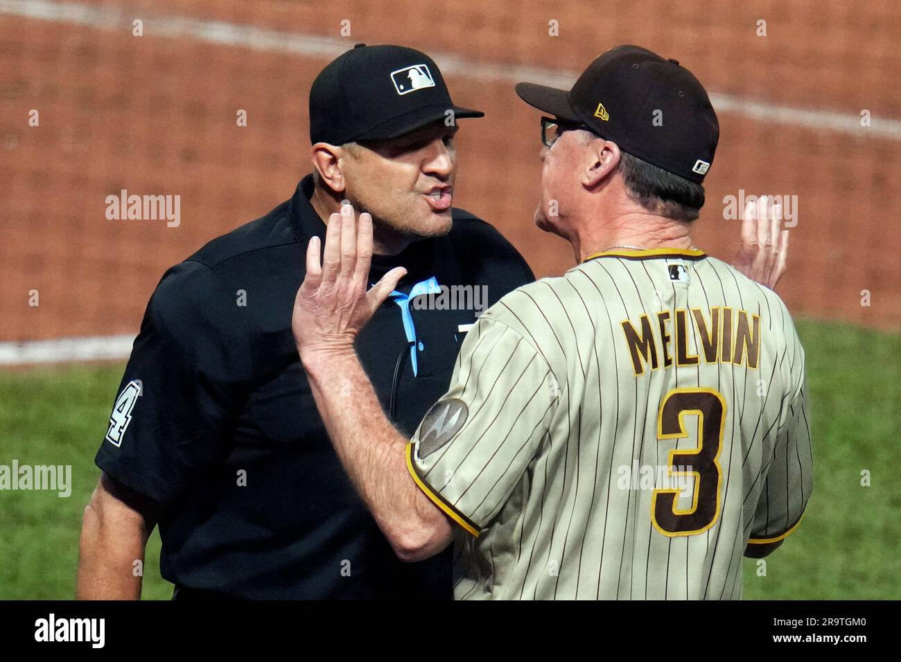 San Diego Padres manager Bob Melvin (3) talks with umpire Chad ...