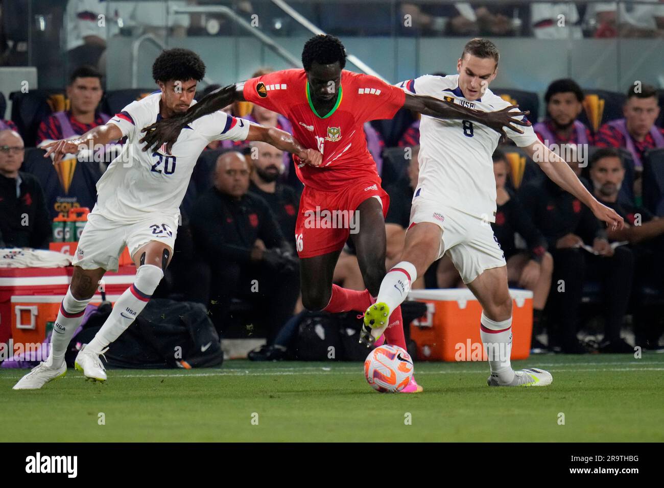St. Kitts & Nevis' Keithroy Freeman, center, battle for the ball ...