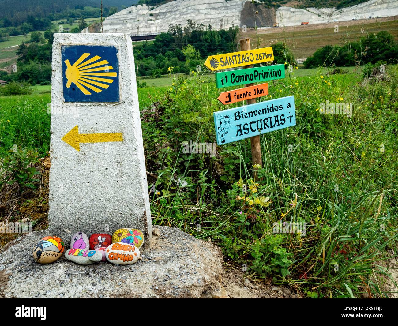 A stone marker is seen pointing the Primitivo's route. The Camino de ...