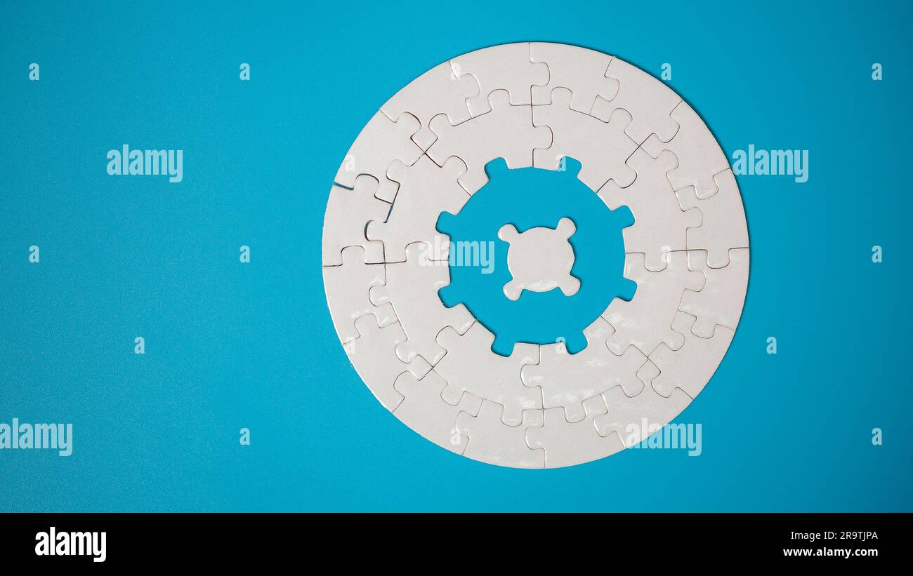 White part of jigsaw puzzle pieces on blue background. concepts of ...