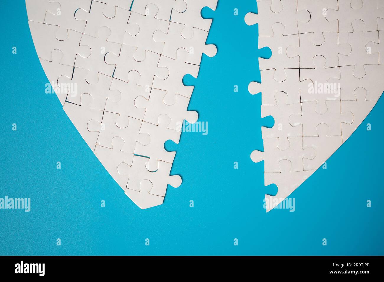 White part of jigsaw puzzle pieces on blue background. concepts of ...