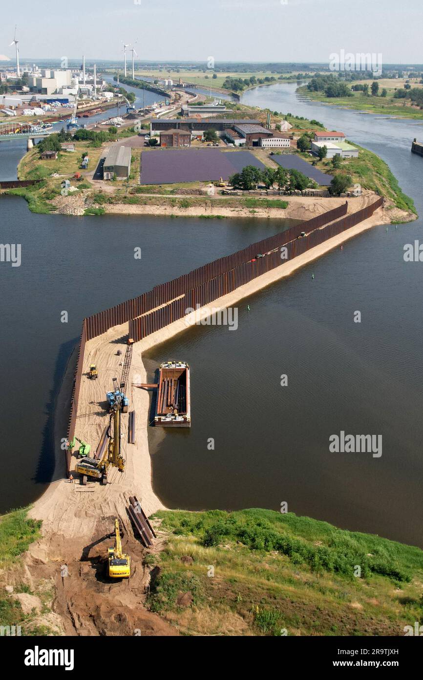 Magdeburg, Germany. 26th June, 2023. Excavators and barges work on the ...