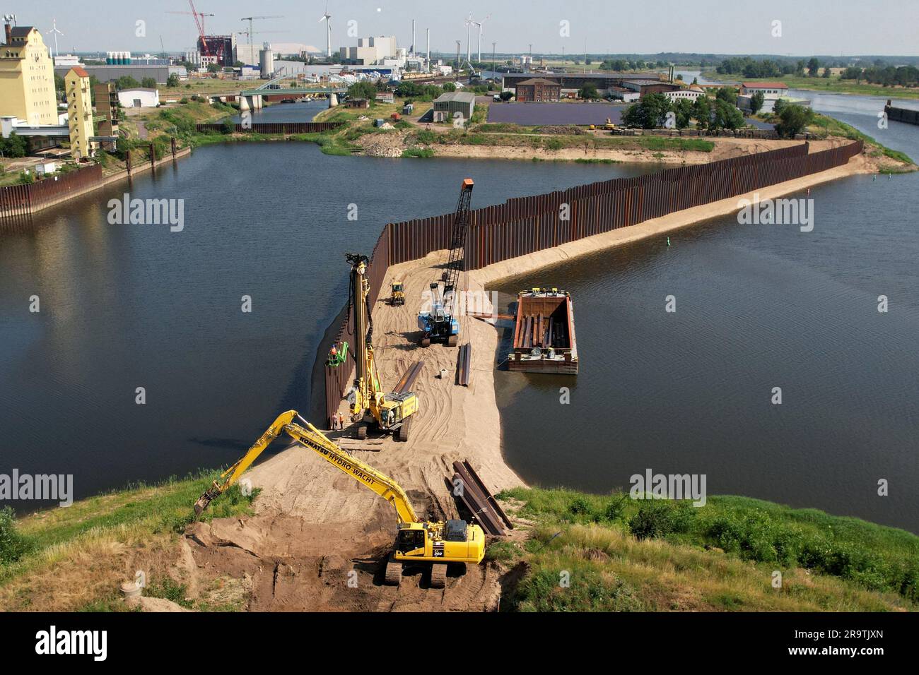 Magdeburg, Germany. 26th June, 2023. Excavators and barges work on the ...
