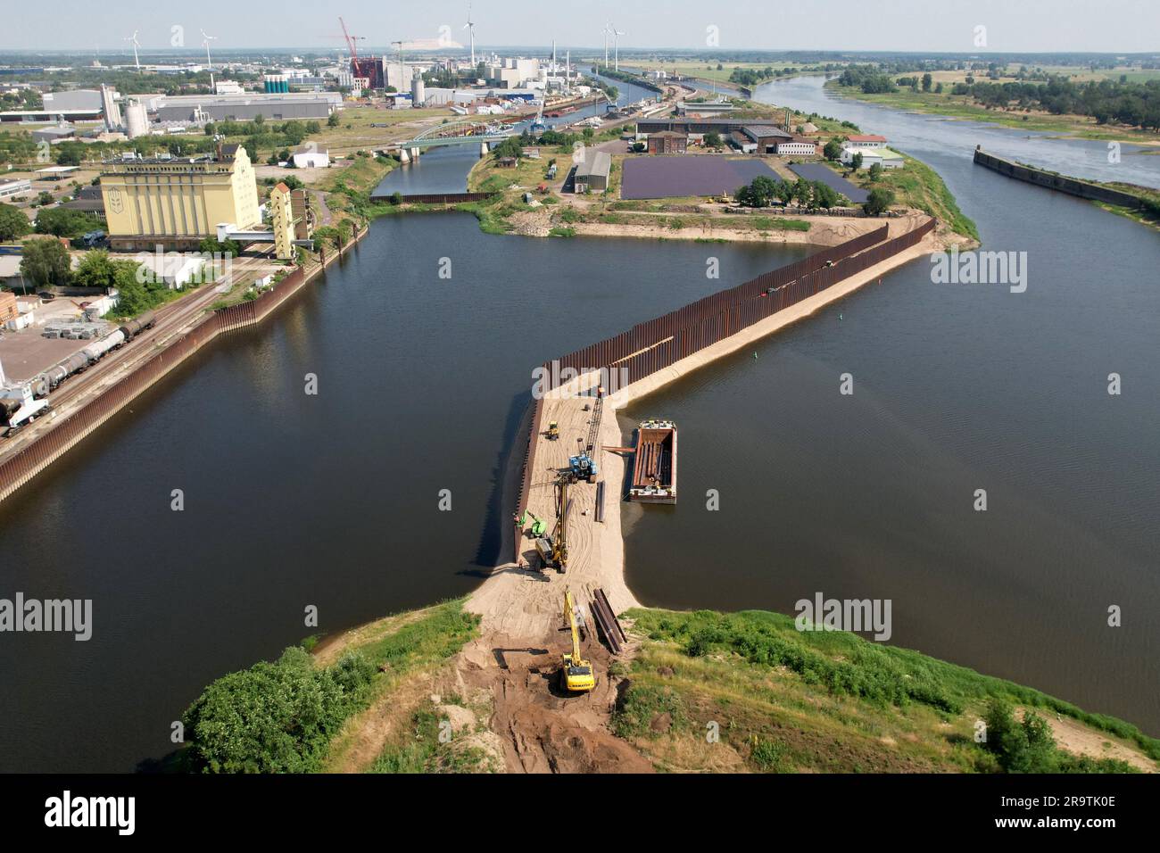 Magdeburg, Germany. 26th June, 2023. Excavators and barges work on the ...
