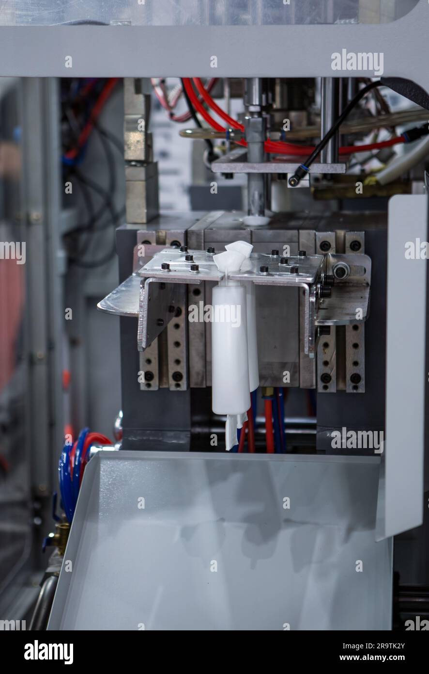 Plastic bottle blow molding machine in manufacturing factory Stock ...