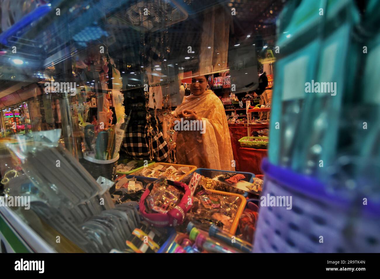 Srinagar, India. 27th June, 2023. Kashmirians do Shopping at the market ...