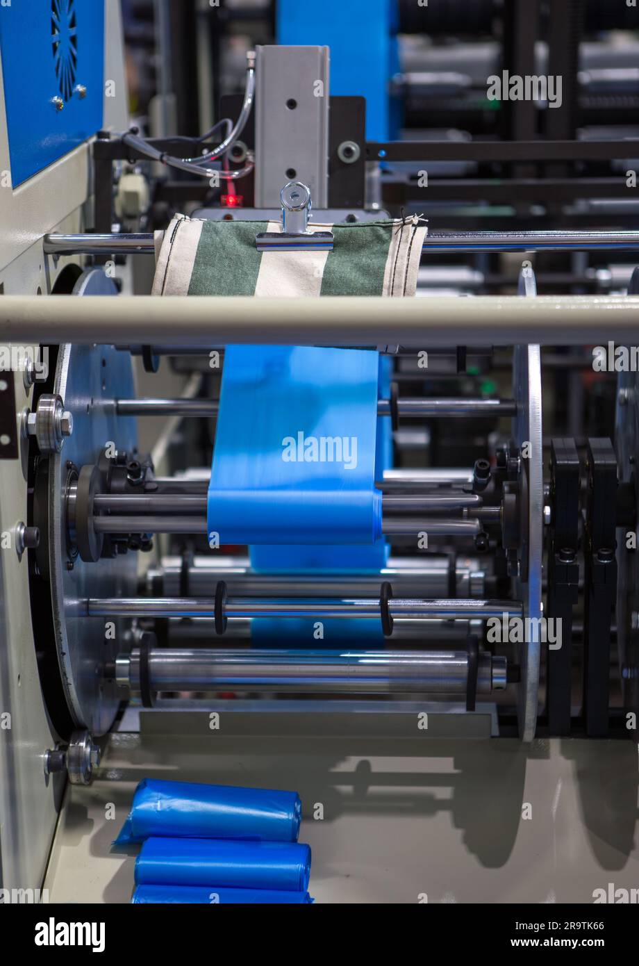 Process of plastic bag roll and cutting machine Stock Photo - Alamy
