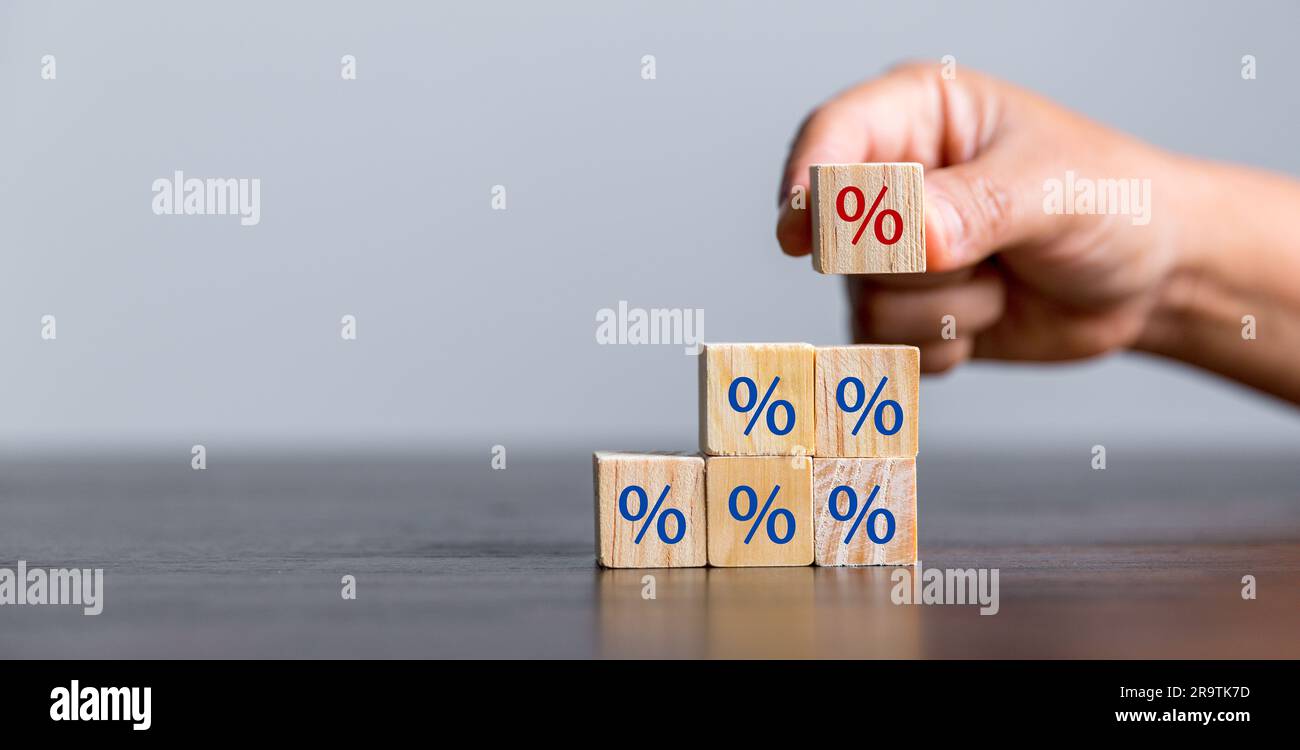 Closeup wood cubes with percentage symbol, Interest rate and dividend ...