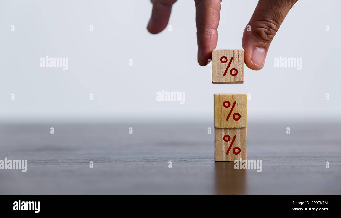 Closeup wood cubes with percentage symbol, Interest rate and dividend concept, wooden block with ...