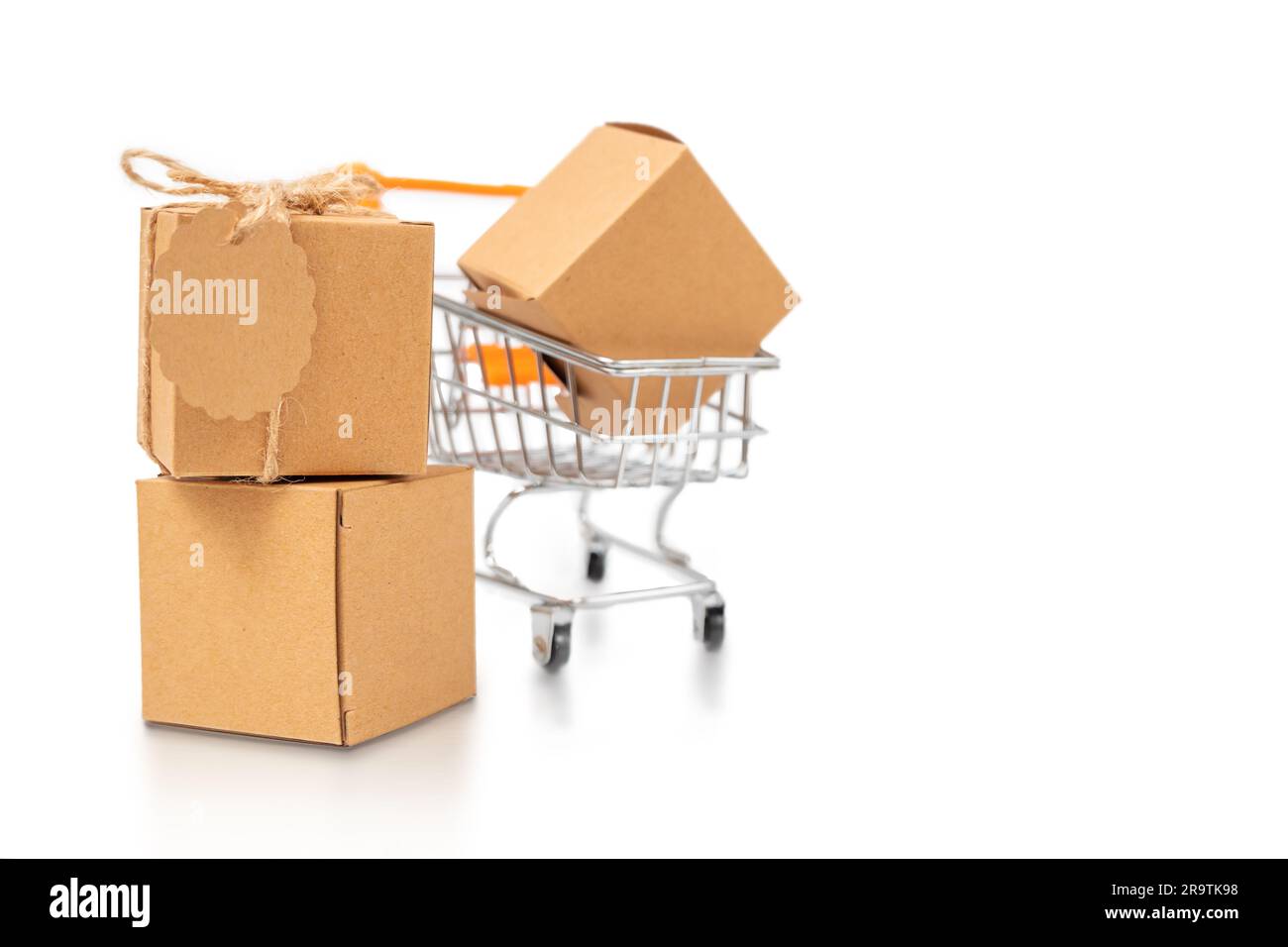 Cardboard boxes and shopping cart isolated on white background Stock ...